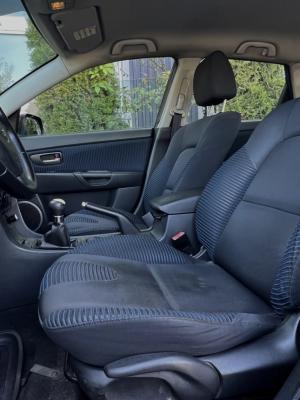 Black Mazda 3 2005 in Riga, with an engine capacity of 1.60 L and mileage of 291 thousand km for 1650 €, photo 7 on AUTOMOTO.COM.LV
