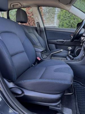 Black Mazda 3 2005 in Riga, with an engine capacity of 1.60 L and mileage of 291 thousand km for 1650 €, photo 11 on AUTOMOTO.COM.LV