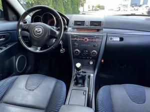 Black Mazda 3 2005 in Riga, with an engine capacity of 1.60 L and mileage of 291 thousand km for 1650 €, photo 13 on AUTOMOTO.COM.LV