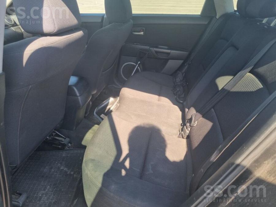 Black Mazda 3 2007 in Riga, with an engine capacity of 1.60 L and mileage of 267 thousand km for 700 €, photo 4 on AUTOMOTO.COM.LV