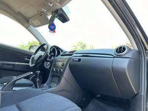 Black Mazda 3 2007 in Riga, with an engine capacity of 1.60 L and mileage of 230 thousand km for 990 €, photo 13 on AUTOMOTO.COM.LV