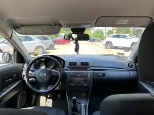 Black Mazda 3 2007 in Riga, with an engine capacity of 1.60 L and mileage of 230 thousand km for 990 €, photo 14 on AUTOMOTO.COM.LV