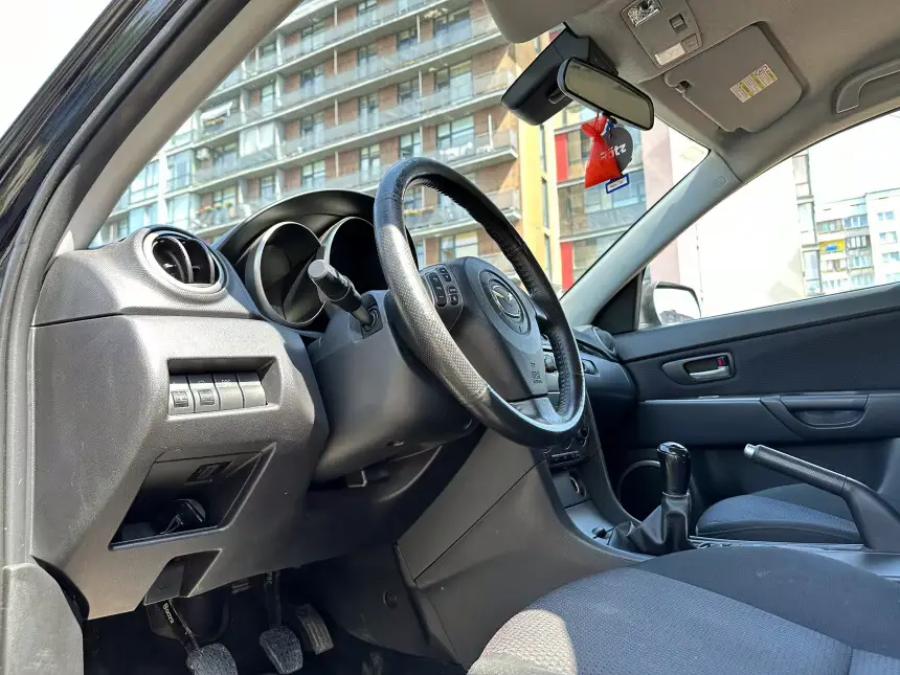 Black Mazda 3 2007 in Riga, with an engine capacity of 1.60 L and mileage of 230 thousand km for 990 €, photo 16 on AUTOMOTO.COM.LV