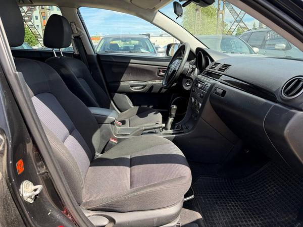 Black Mazda 3 2008 in Tallinn, with an engine capacity of 1.60 L and mileage of 253 thousand km for 699 €, photo 6 on AUTOMOTO.COM.LV