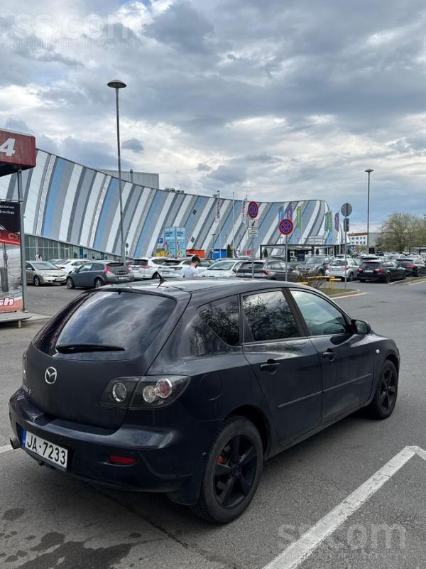 Black Mazda 3 2006 in Riga, with an engine capacity of 1.60 L and mileage of 151 thousand km for 1100 €, photo 10 on AUTOMOTO.COM.LV