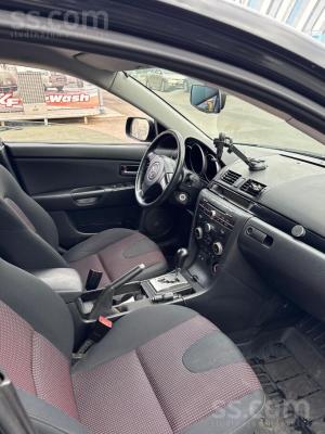 Black Mazda 3 2006 in Riga, with an engine capacity of 1.60 L and mileage of 152 thousand km for 1100 €, photo 10 on AUTOMOTO.COM.LV