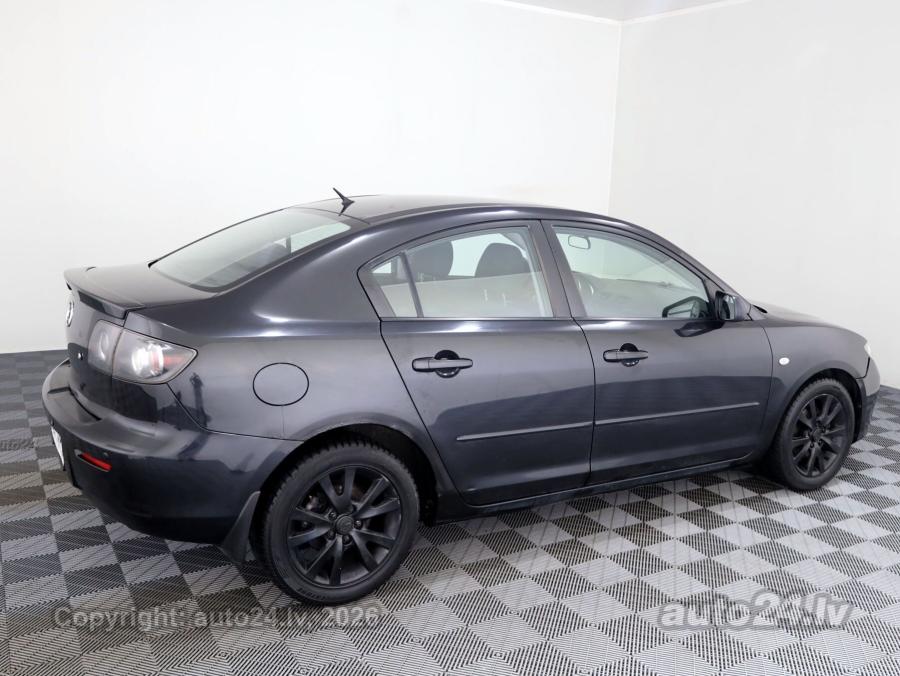 Black Mazda 3 2007 in Tallinn, with an engine capacity of 1.60 L and mileage of 197 thousand km for 899 €, photo 4 on AUTOMOTO.COM.LV