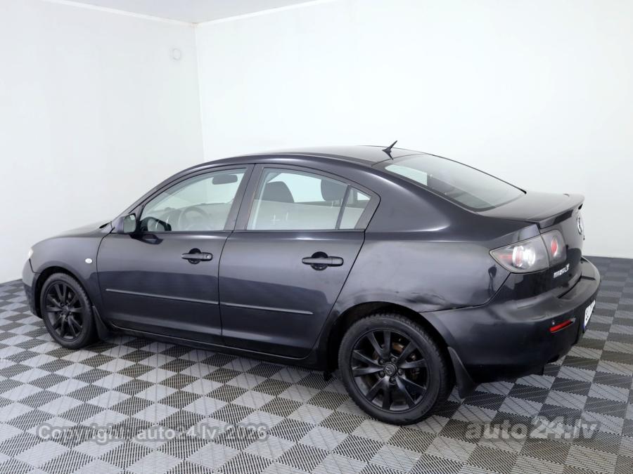 Black Mazda 3 2007 in Tallinn, with an engine capacity of 1.60 L and mileage of 197 thousand km for 899 €, photo 5 on AUTOMOTO.COM.LV