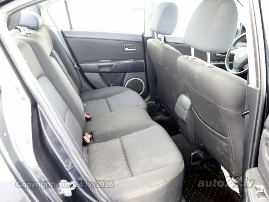 Black Mazda 3 2007 in Tallinn, with an engine capacity of 1.60 L and mileage of 197 thousand km for 899 €, photo 8 on AUTOMOTO.COM.LV