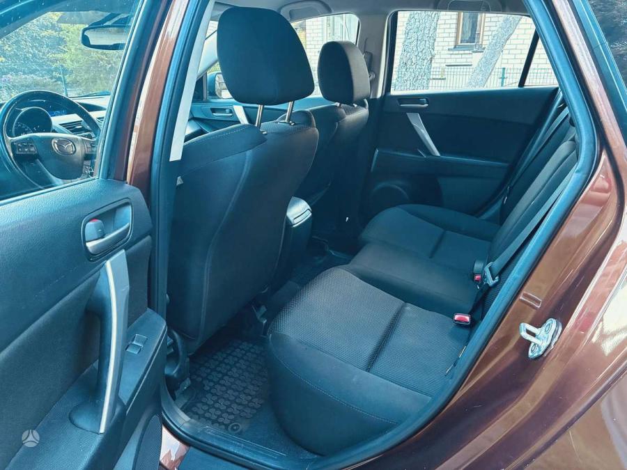 Brown Mazda 3 2012 in Kaunas, with an engine capacity of 1.60 L and mileage of 109 thousand km for 4999 €, photo 14 on AUTOMOTO.COM.LV