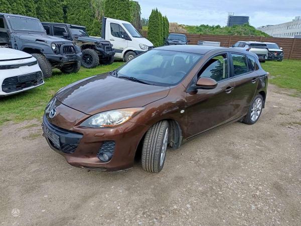 Brown Mazda 3 2012 in Marijampole, with an engine capacity of 2.00 L and mileage of 198 thousand km for 3249 €, photo 8 on AUTOMOTO.COM.LV