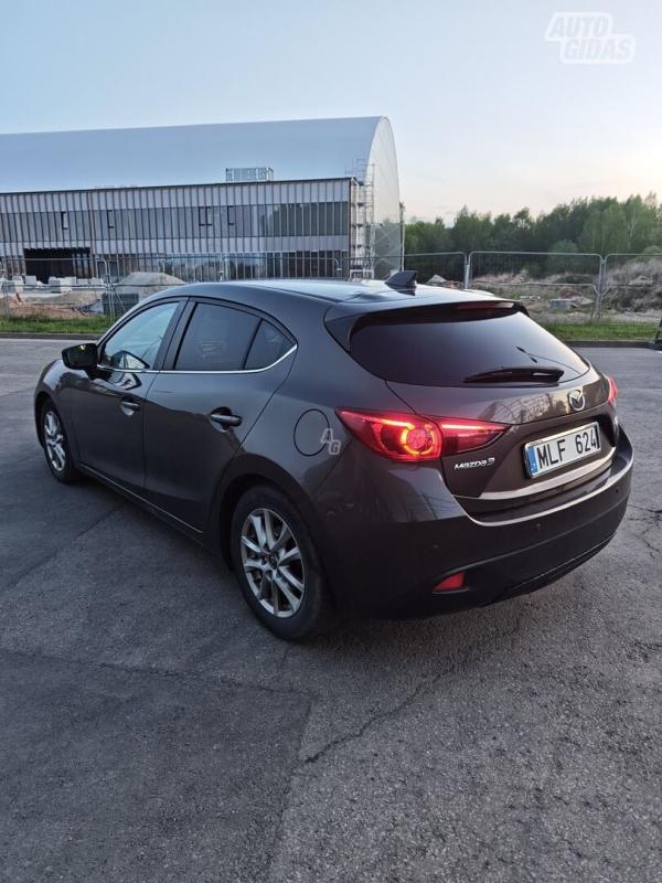 Brown Mazda 3 2015 in Siauliai, with an engine capacity of 1.50 L and mileage of 133 thousand km for 7990 €, photo 4 on AUTOMOTO.COM.LV