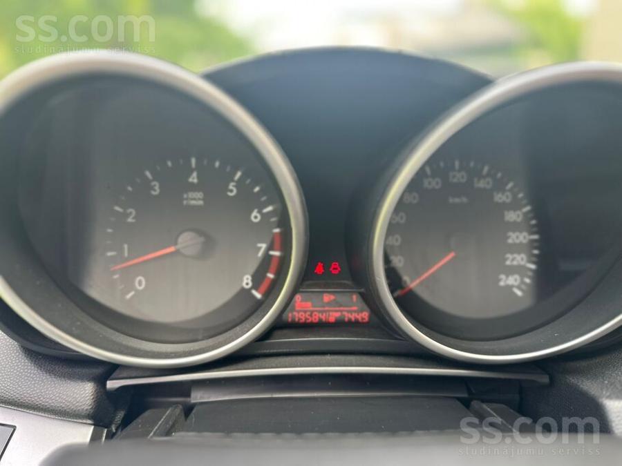 Grey Mazda 3 2009 in Riga, with an engine capacity of 1.60 L and mileage of 180 thousand km for 2000 €, photo 11 on AUTOMOTO.COM.LV