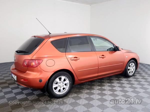Orange Mazda 3 2005 in Tallinn, with an engine capacity of 1.60 L and mileage of 273 thousand km for 1199 €, photo 3 on AUTOMOTO.COM.LV