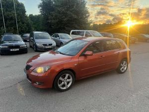 Red Mazda 3 2005 in Vilnius, with an engine capacity of 1.60 L and mileage of 198 thousand km for 1650 €, photo 3 on AUTOMOTO.COM.LV