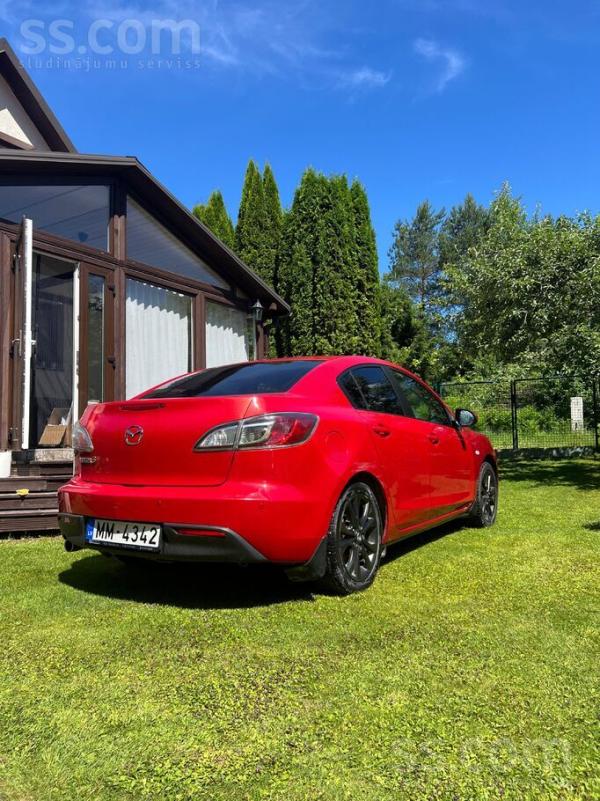 Red Mazda 3 2010 in Riga, with an engine capacity of 2.00 L and mileage of 234 thousand km for 2500 €, photo 3 on AUTOMOTO.COM.LV