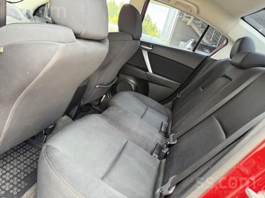 Red Mazda 3 2010 in Riga, with an engine capacity of 2.00 L and mileage of 234 thousand km for 1990 €, photo 12 on AUTOMOTO.COM.LV