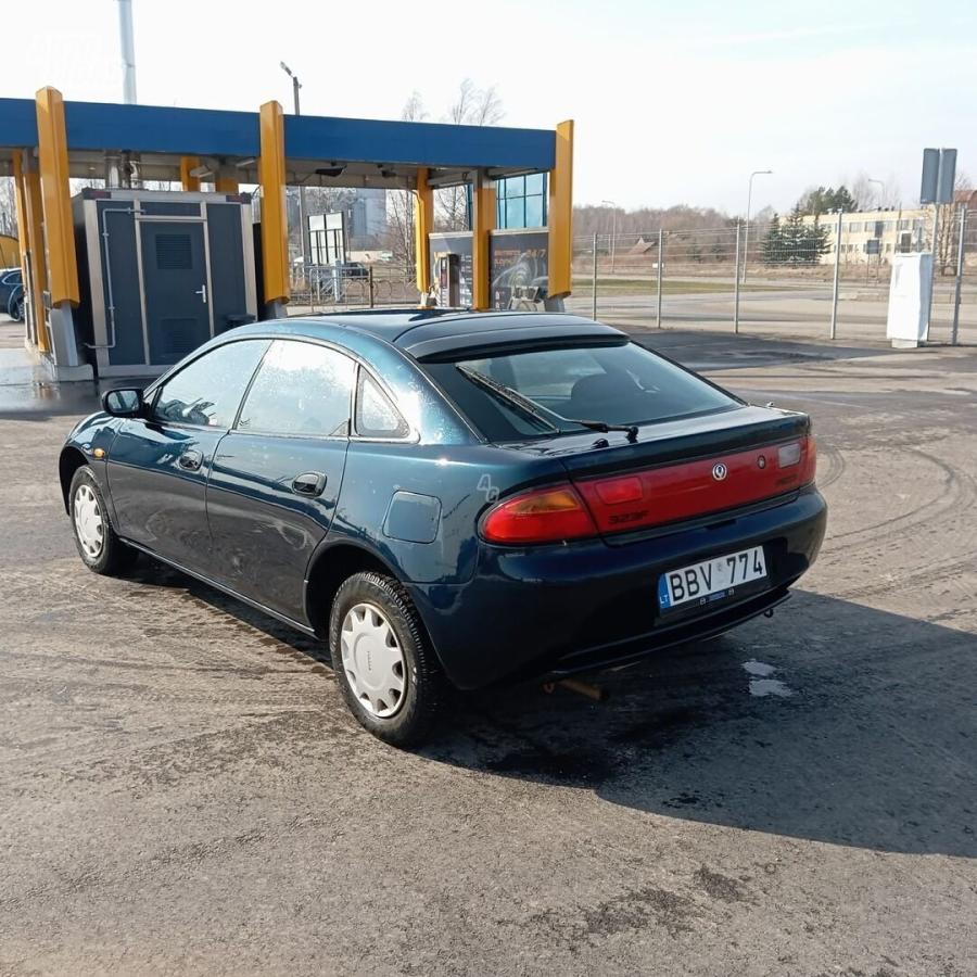 Zaļš Mazda 323 1994 Panevēža, ar dzinēja tilpumu 1.50 L un nobraukumu 206 tūkst. km par 1000 €, foto 2 vietnē AUTOMOTO.COM.LV