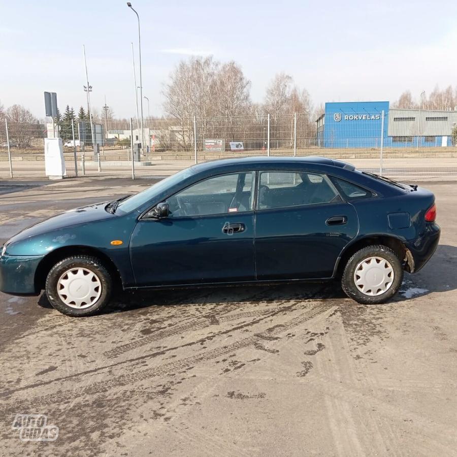 Zaļš Mazda 323 1994 Panevēža, ar dzinēja tilpumu 1.50 L un nobraukumu 206 tūkst. km par 1000 €, foto 3 vietnē AUTOMOTO.COM.LV