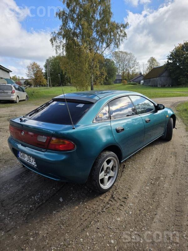 Green Mazda 323 1997 in Aluksne, with an engine capacity of 1.50 L and mileage of 291 thousand km for 1650 €, photo 5 on AUTOMOTO.COM.LV