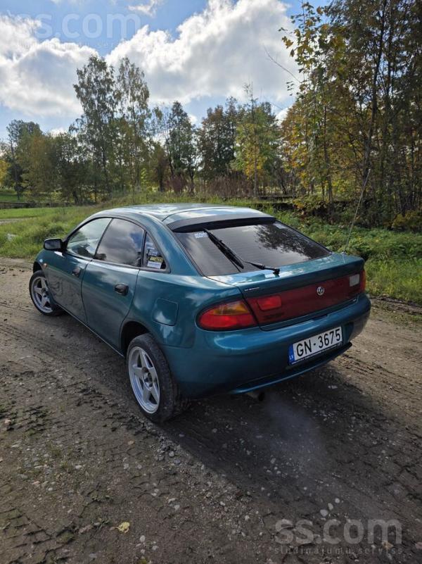 Green Mazda 323 1997 in Aluksne, with an engine capacity of 1.50 L and mileage of 291 thousand km for 1650 €, photo 6 on AUTOMOTO.COM.LV