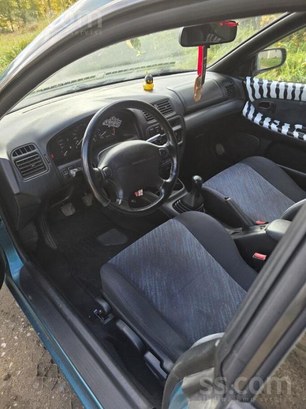 Green Mazda 323 1997 in Aluksne, with an engine capacity of 1.50 L and mileage of 291 thousand km for 1650 €, photo 9 on AUTOMOTO.COM.LV