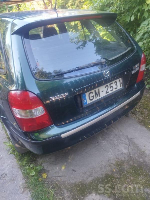 Green Mazda 323 1999 in Riga, with an engine capacity of 2.00 L and mileage of 345 thousand km for 435 €, photo 1 on AUTOMOTO.COM.LV