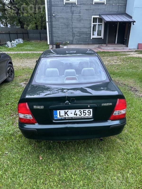 Mazda 323 1999 Rīga vietnē Zaļš Mazda 323 1999 Rīga, ar dzinēja tilpumu 1.50 L un nobraukumu 252 tūkst. km par 1000 €, foto 4 vietnē AUTOMOTO.COM.LV