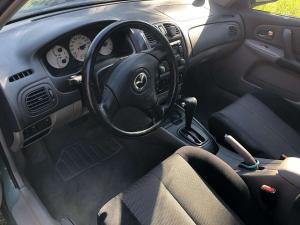 Green Mazda 323 2002 in Vilnius, with an engine capacity of 1.60 L and mileage of 143 thousand km for 600 €, photo 4 on AUTOMOTO.COM.LV
