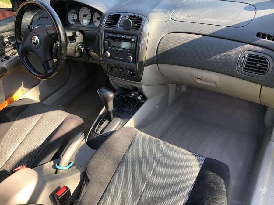 Green Mazda 323 2002 in Vilnius, with an engine capacity of 1.60 L and mileage of 143 thousand km for 600 €, photo 5 on AUTOMOTO.COM.LV