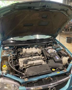 Green Mazda 323 2002 in Vilnius, with an engine capacity of 1.60 L and mileage of 143 thousand km for 600 €, photo 10 on AUTOMOTO.COM.LV