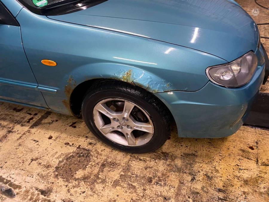 Green Mazda 323 2002 in Vilnius, with an engine capacity of 1.60 L and mileage of 143 thousand km for 600 €, photo 11 on AUTOMOTO.COM.LV