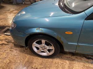 Green Mazda 323 2002 in Vilnius, with an engine capacity of 1.60 L and mileage of 143 thousand km for 600 €, photo 12 on AUTOMOTO.COM.LV