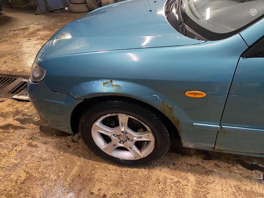 Green Mazda 323 2002 in Vilnius, with an engine capacity of 1.60 L and mileage of 143 thousand km for 600 €, photo 12 on AUTOMOTO.COM.LV