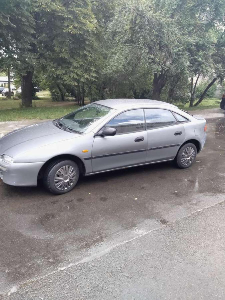 Pelēks Mazda 323 1995 Viļņa, ar dzinēja tilpumu 1.49 L un nobraukumu 290 tūkst. km par 1600 €, foto 1 vietnē AUTOMOTO.COM.LV