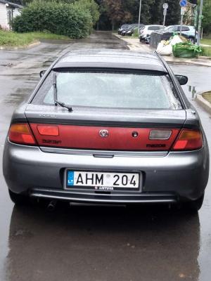 Pelēks Mazda 323 1995 Viļņa, ar dzinēja tilpumu 1.49 L un nobraukumu 290 tūkst. km par 1600 €, foto 4 vietnē AUTOMOTO.COM.LV
