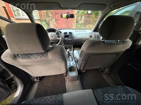 Grey Mazda 323 2000 in Riga, with an engine capacity of 1.50 L and mileage of 190 thousand km for 1490 €, photo 10 on AUTOMOTO.COM.LV