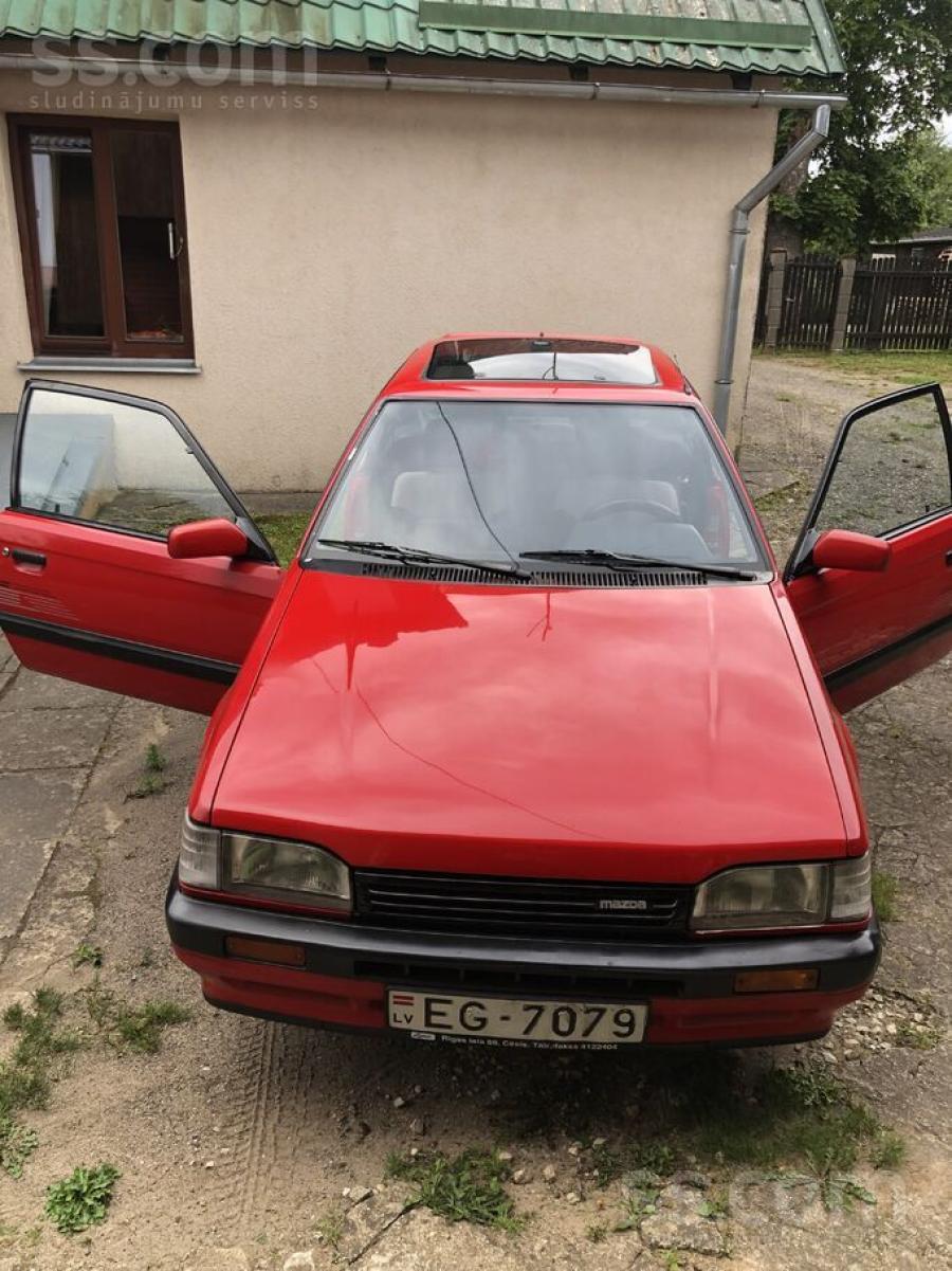 Red Mazda 323 1989 in Cesis, with an engine capacity of 1.60 L and mileage of 211 thousand km for 3500 €, photo 1 on AUTOMOTO.COM.LV
