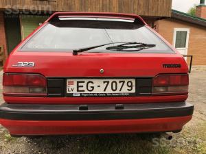 Red Mazda 323 1989 in Cesis, with an engine capacity of 1.60 L and mileage of 211 thousand km for 3500 €, photo 3 on AUTOMOTO.COM.LV