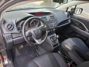 Black Mazda 5 2011 in Marijampole, with an engine capacity of 1.56 L and mileage of 237 thousand km for 3950 €, photo 16 on AUTOMOTO.COM.LV