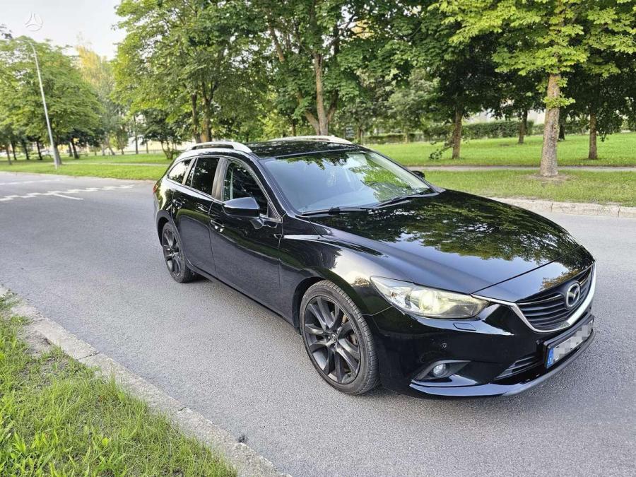 Black Mazda 6 2013 in Panevezys, with an engine capacity of 2.18 L and mileage of 218 thousand km for 5200 €, photo 1 on AUTOMOTO.COM.LV