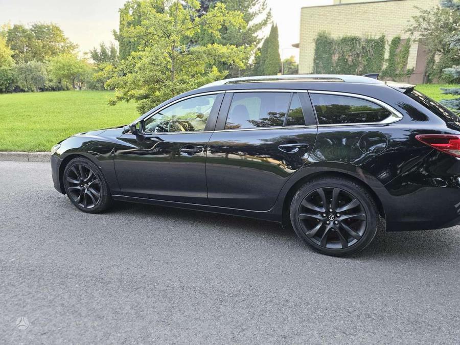 Black Mazda 6 2013 in Panevezys, with an engine capacity of 2.18 L and mileage of 218 thousand km for 5200 €, photo 5 on AUTOMOTO.COM.LV