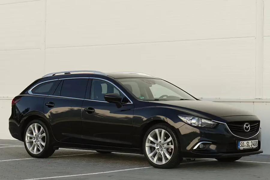 Black Mazda 6 2014 in Riga, with an engine capacity of 2.20 L and mileage of 188 thousand km for 7700 €, photo 11 on AUTOMOTO.COM.LV