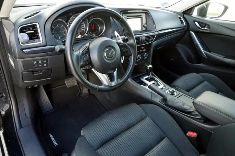 Black Mazda 6 2014 in Riga, with an engine capacity of 2.20 L and mileage of 188 thousand km for 7700 €, photo 16 on AUTOMOTO.COM.LV