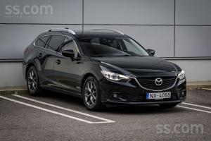 Black Mazda 6 2014 in Riga, with an engine capacity of 2.20 L and mileage of 237 thousand km for 5990 €, photo 6 on AUTOMOTO.COM.LV