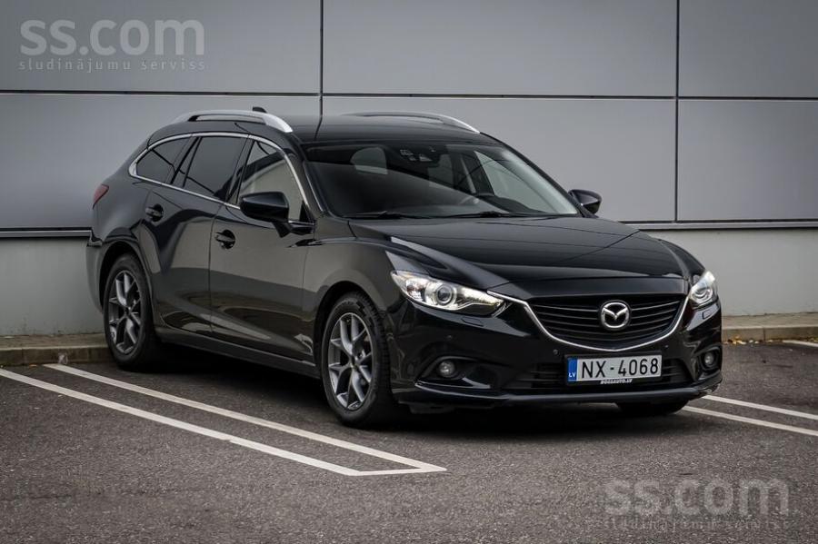 Black Mazda 6 2014 in Riga, with an engine capacity of 2.20 L and mileage of 237 thousand km for 5990 €, photo 6 on AUTOMOTO.COM.LV