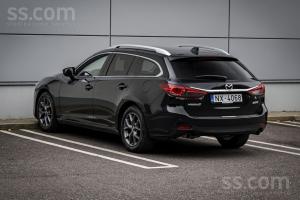 Black Mazda 6 2014 in Riga, with an engine capacity of 2.20 L and mileage of 237 thousand km for 5990 €, photo 12 on AUTOMOTO.COM.LV