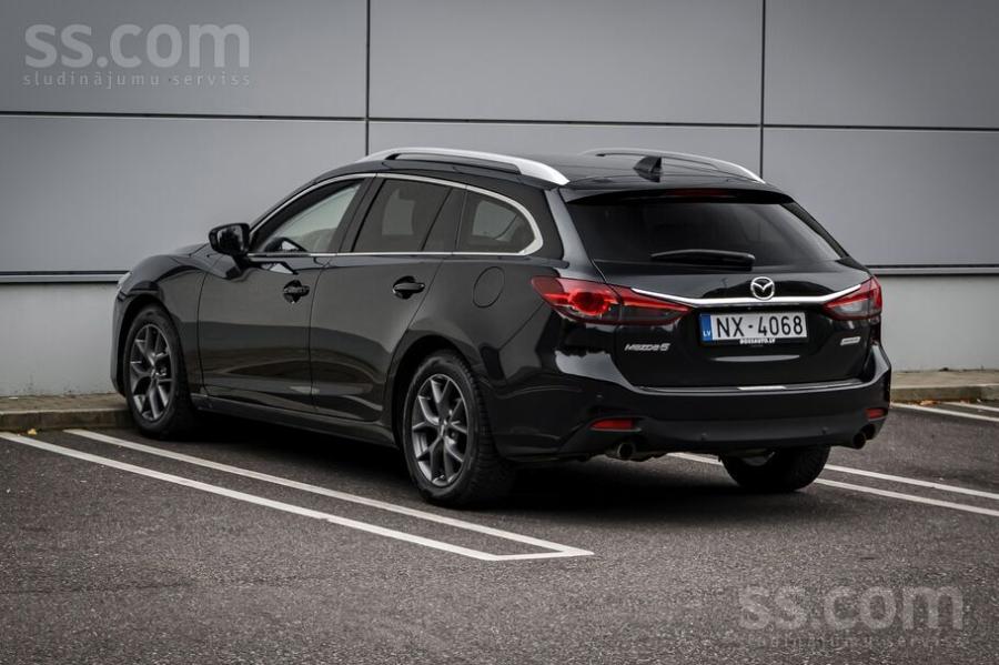 Black Mazda 6 2014 in Riga, with an engine capacity of 2.20 L and mileage of 237 thousand km for 5990 €, photo 13 on AUTOMOTO.COM.LV