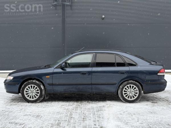 Blue Mazda 626 1999 in Riga, with an engine capacity of 1.80 L and mileage of 217 thousand km for 1699 €, photo 2 on AUTOMOTO.COM.LV