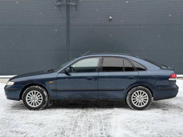 Blue Mazda 626 1999 in Riga, with an engine capacity of 1.80 L and mileage of 217 thousand km for 1699 €, photo 2 on AUTOMOTO.COM.LV